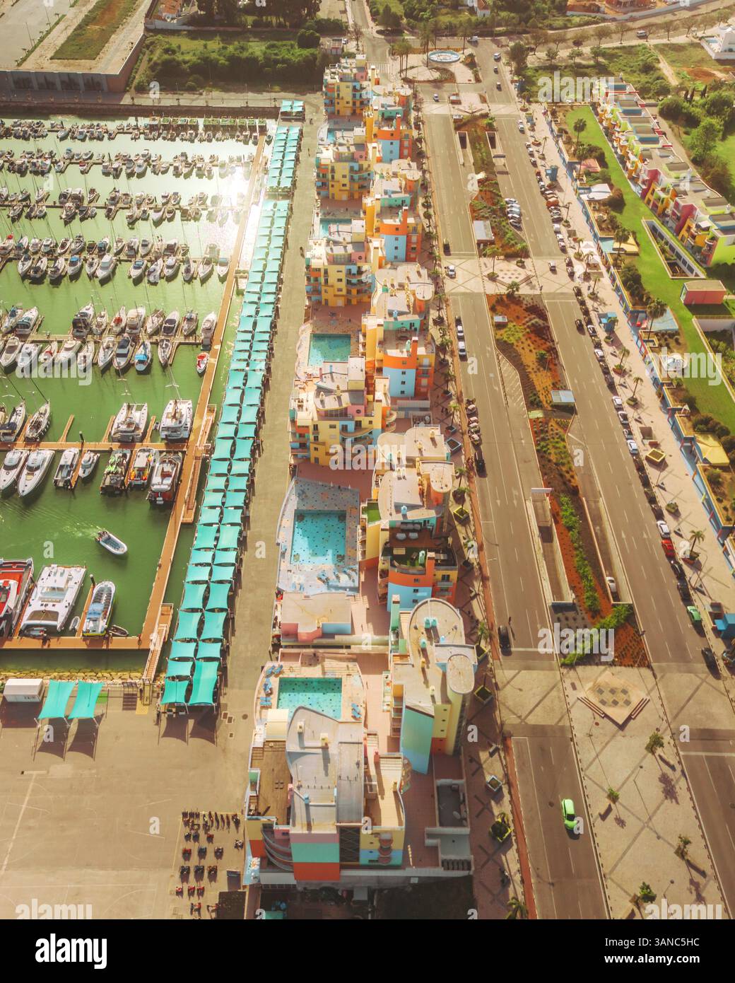Aerial view of colorful buildings and boats at Albufeira Marina ...