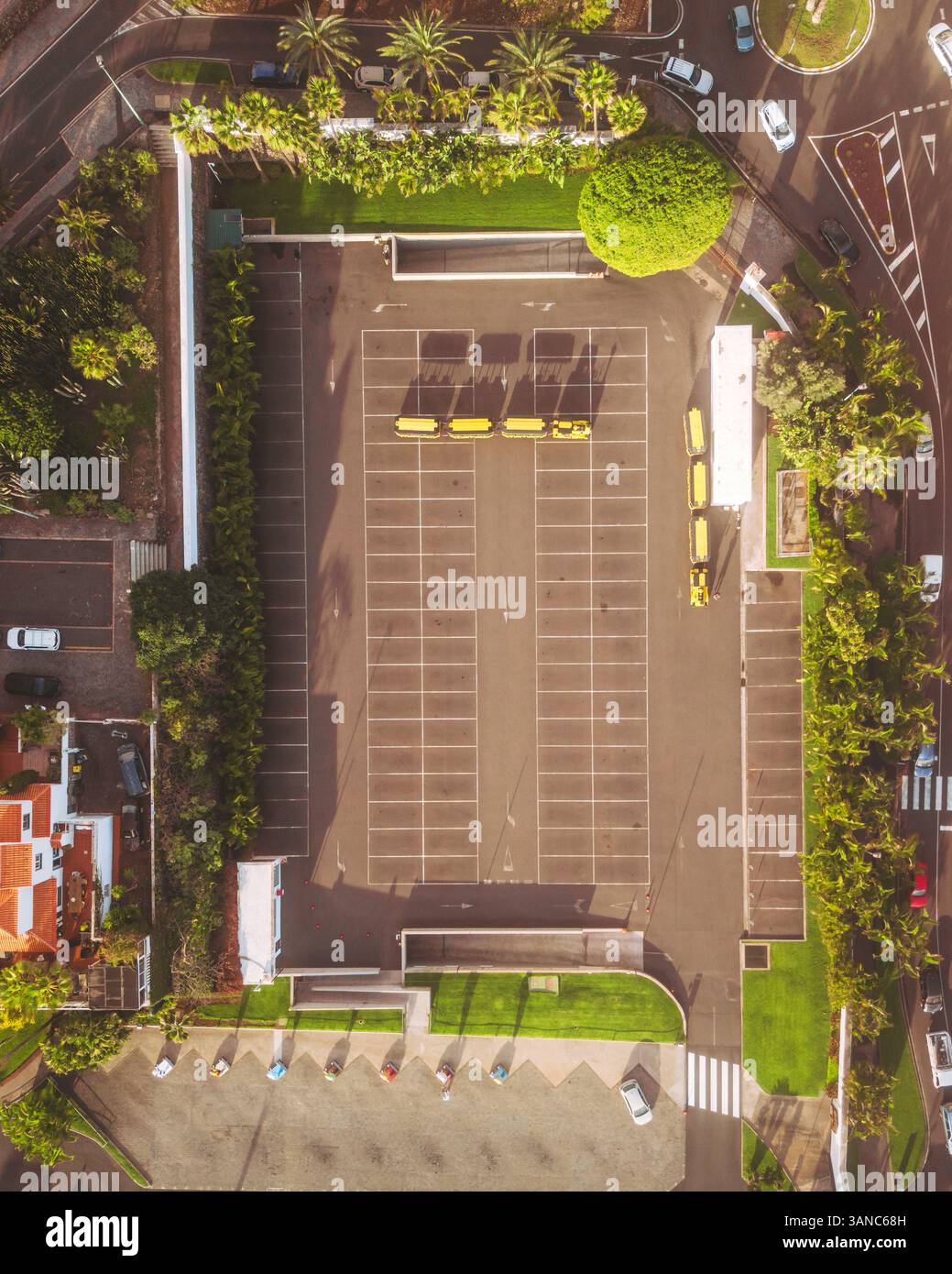 Aerial view of Loro Parque and urban landscape with parking lot, yellow ...