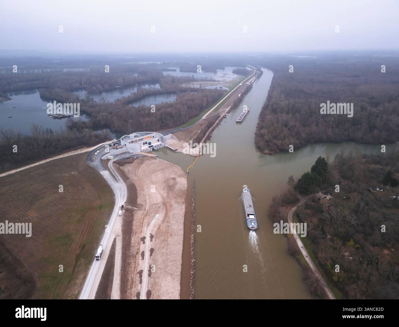 Aerial view of the seine river retention basin with barges and lush ...