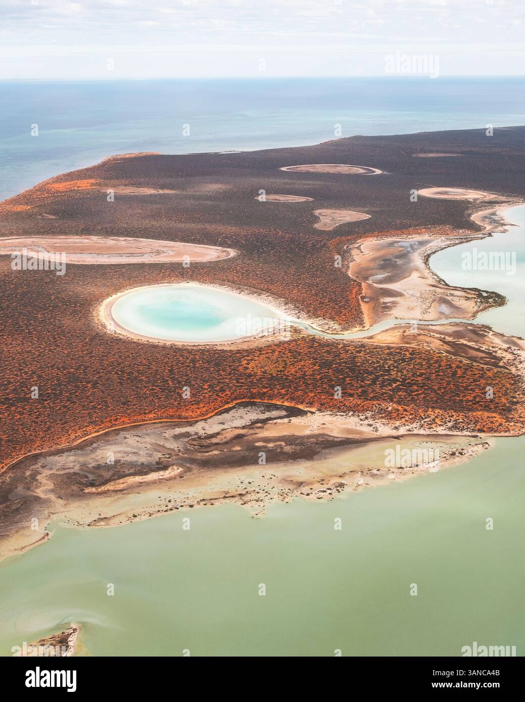Aerial view of big lagoon surrounded by pristine coastline and ...
