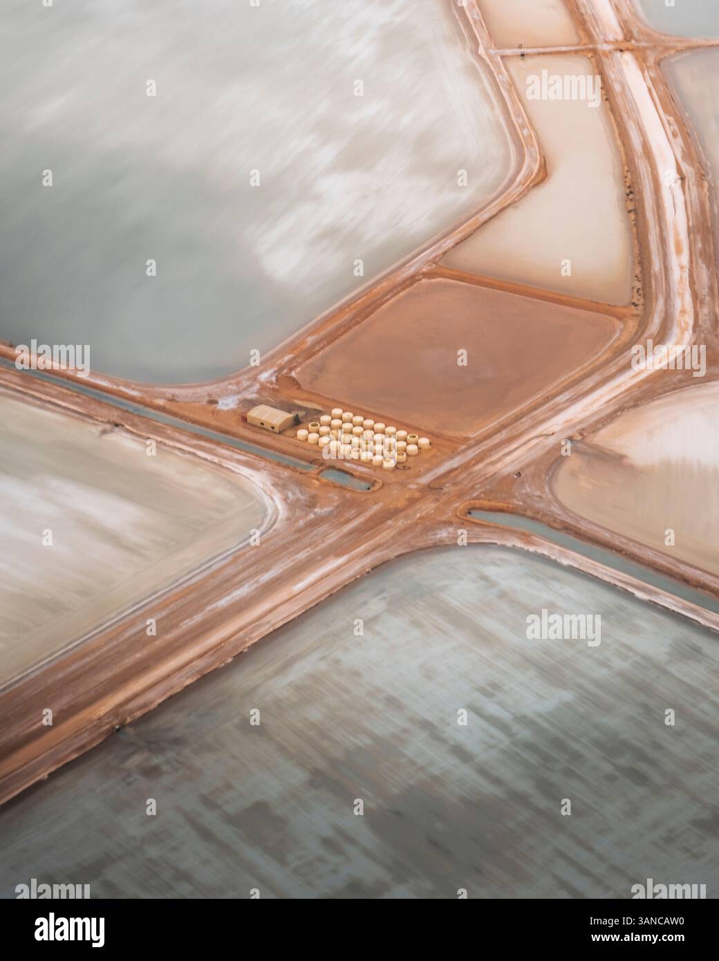 Aerial view of beautiful salt marshes with geometric patterns and roads ...