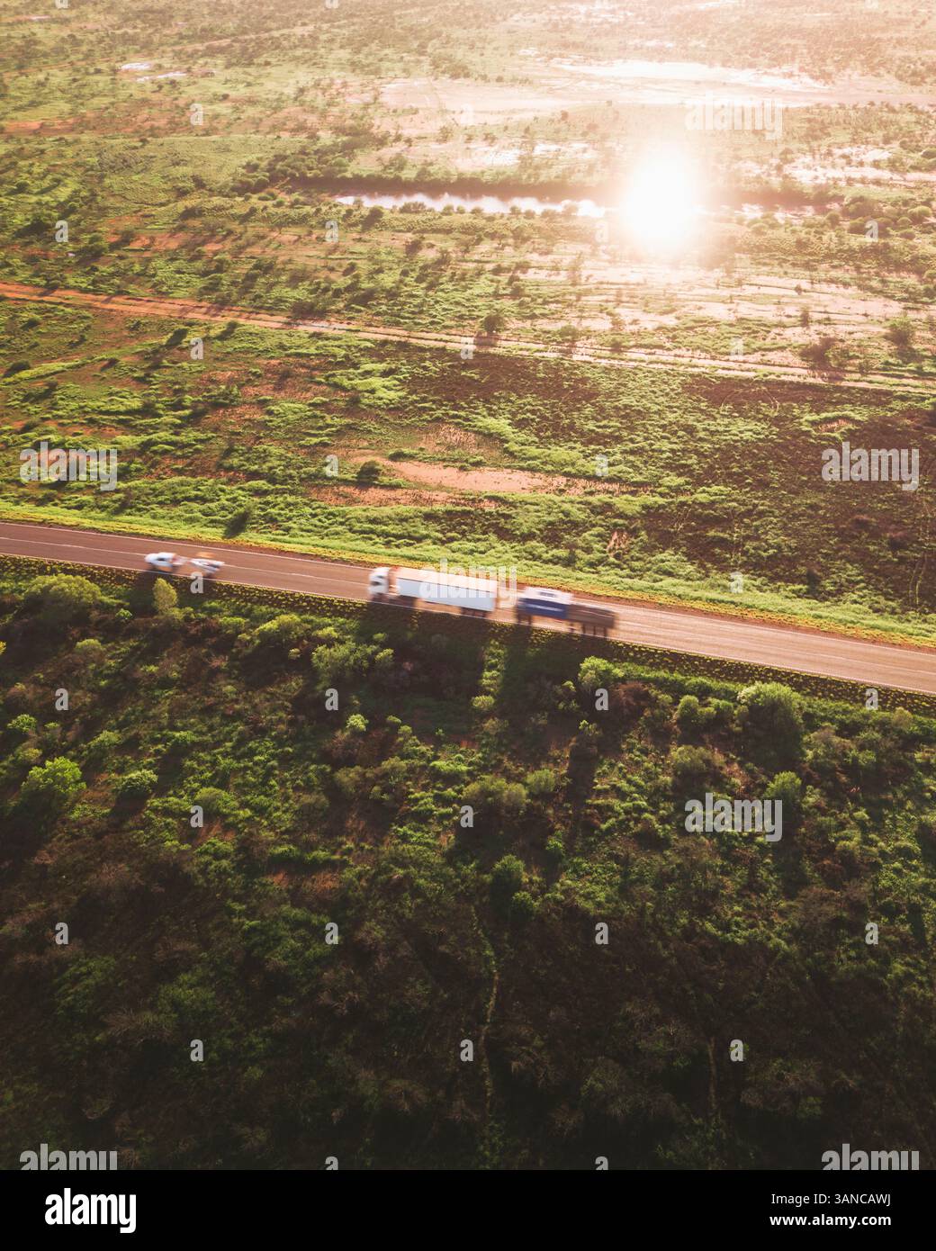 Aerial view of minilya camping with roadtrain on a scenic rural road ...