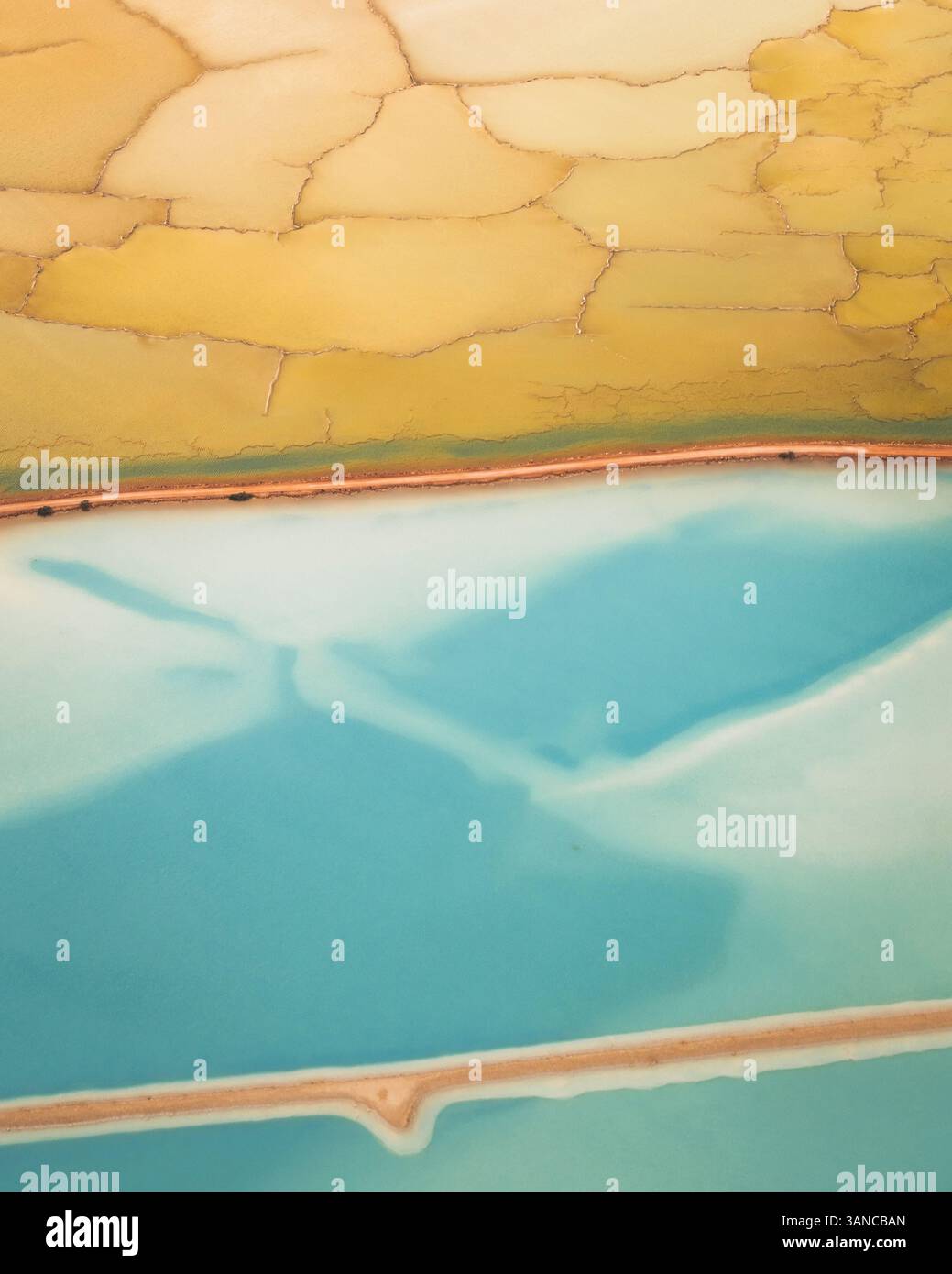 Aerial view of beautiful salt marshes with vivid patterns and turquoise ...