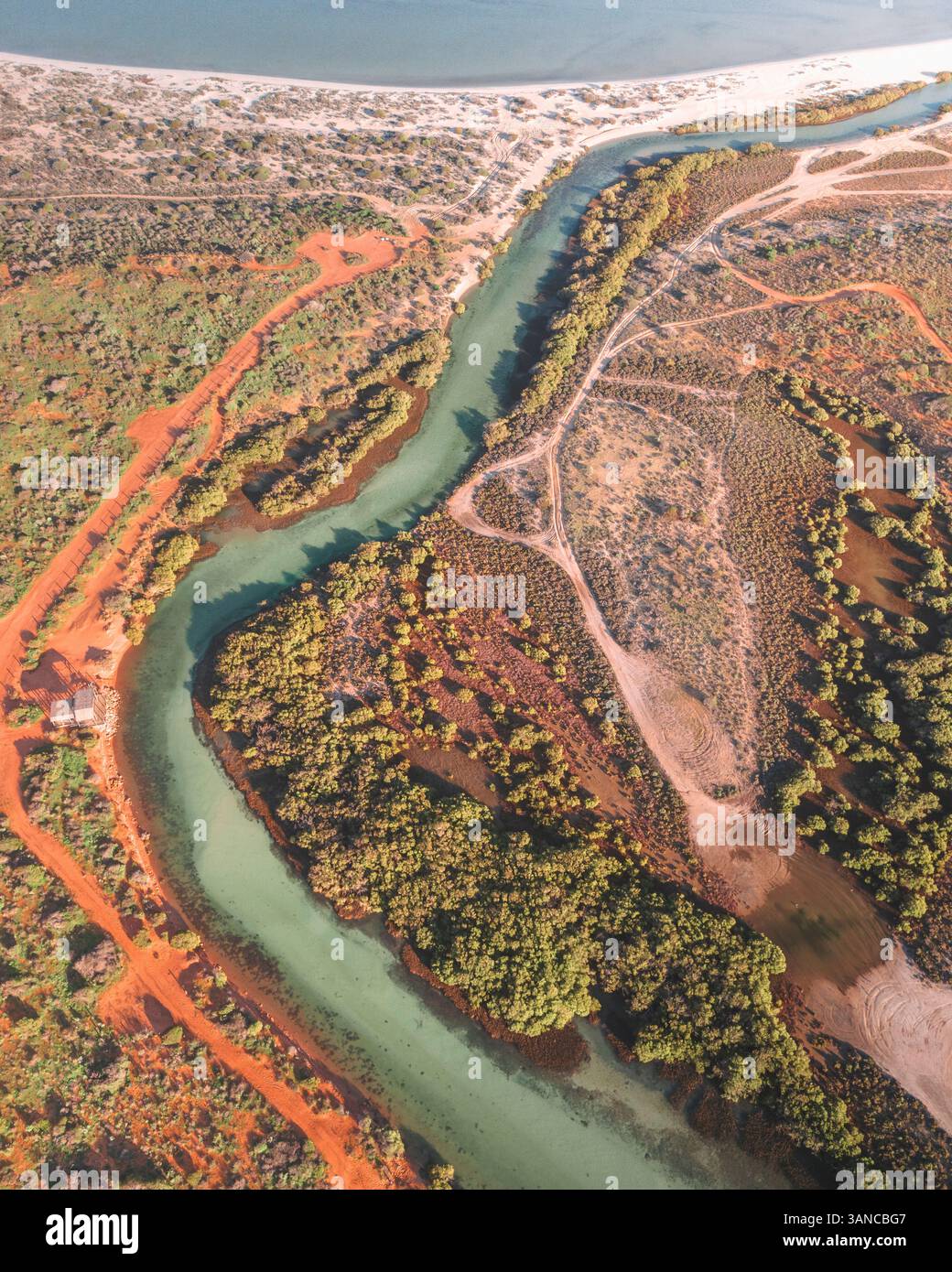 Aerial view of Little Lagoon Creek with winding river and lush greenery ...