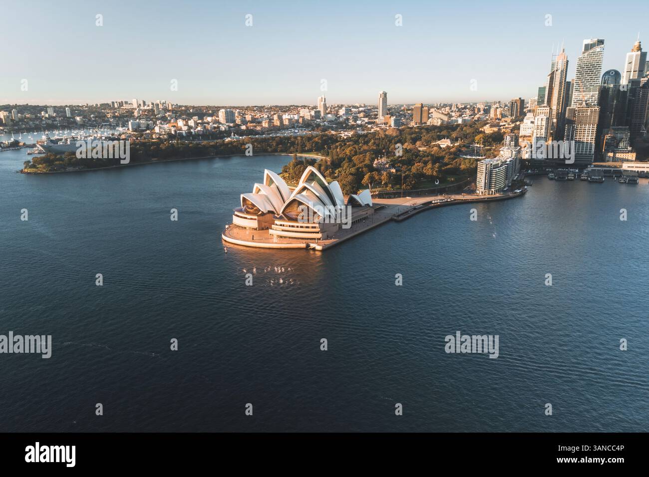 Aerial view of sydney opera house at sunrise with vibrant cityscape and ...