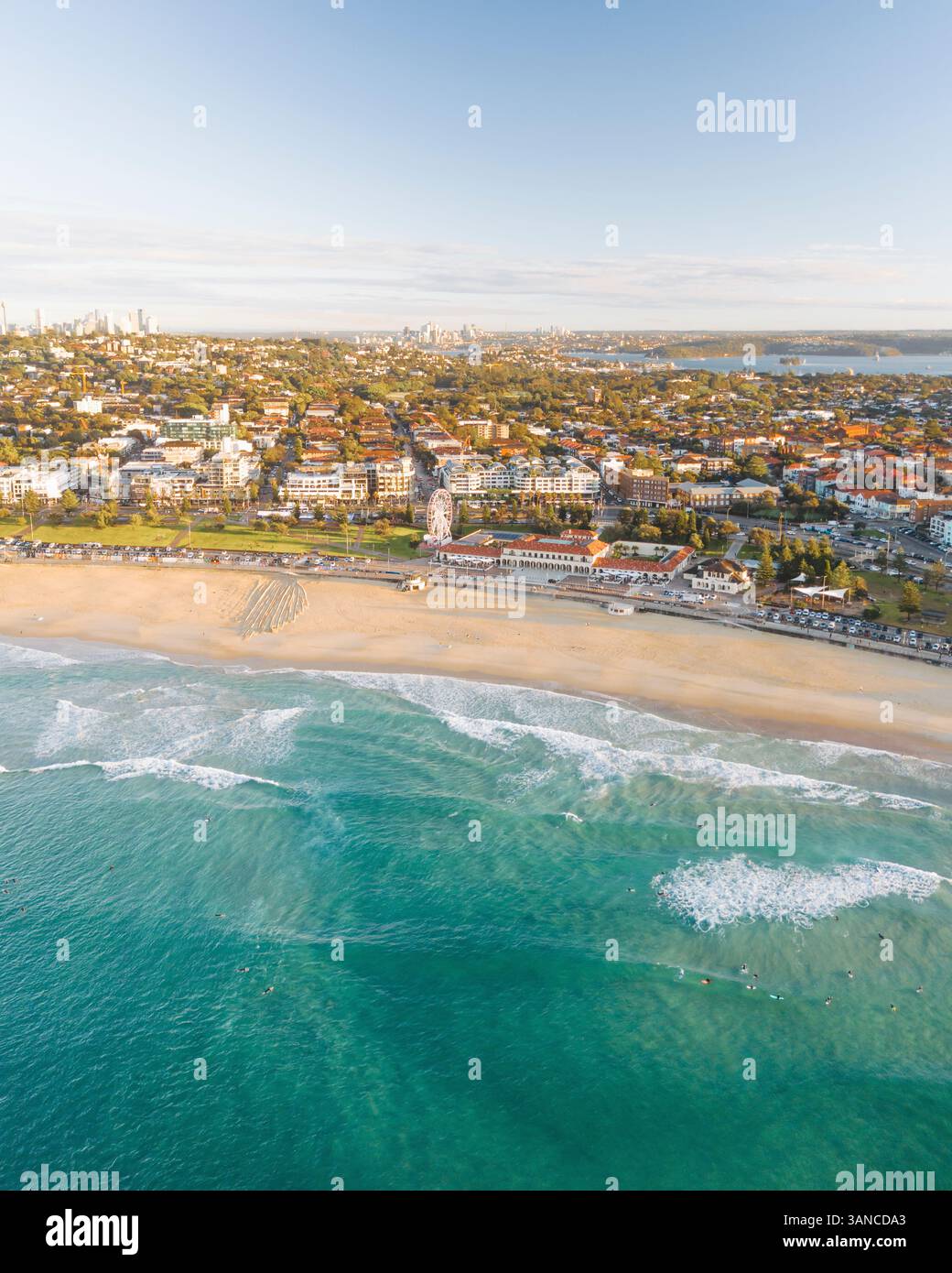 Aerial view of beautiful Bondi Beach with sandy shoreline and crashing ...