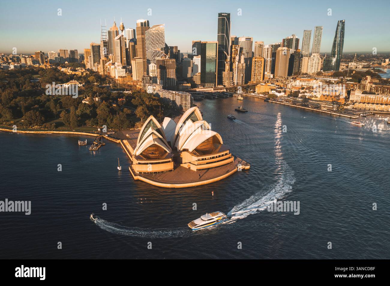 Aerial view of sydney opera house at sunrise with vibrant skyline and ...