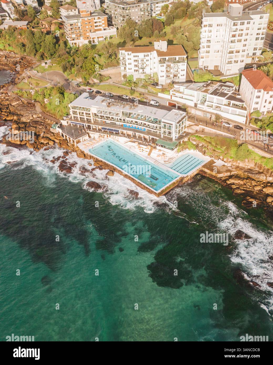 Aerial view of bondi icebergs swimming club with ocean waves and sandy ...