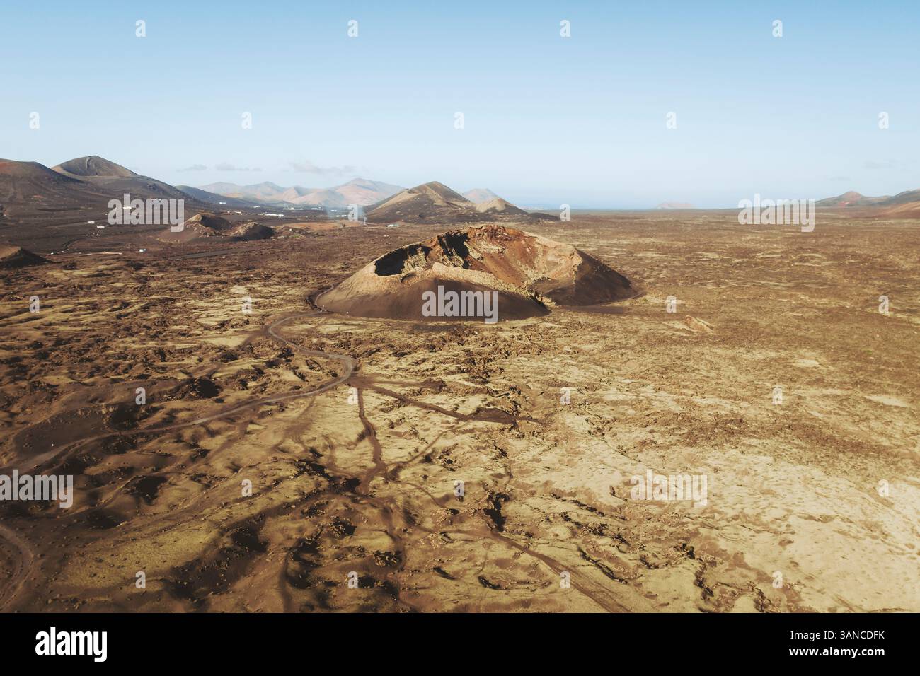 Aerial view of Volcan El Cuervo in desert terrain, Tinajo, Lanzarote ...