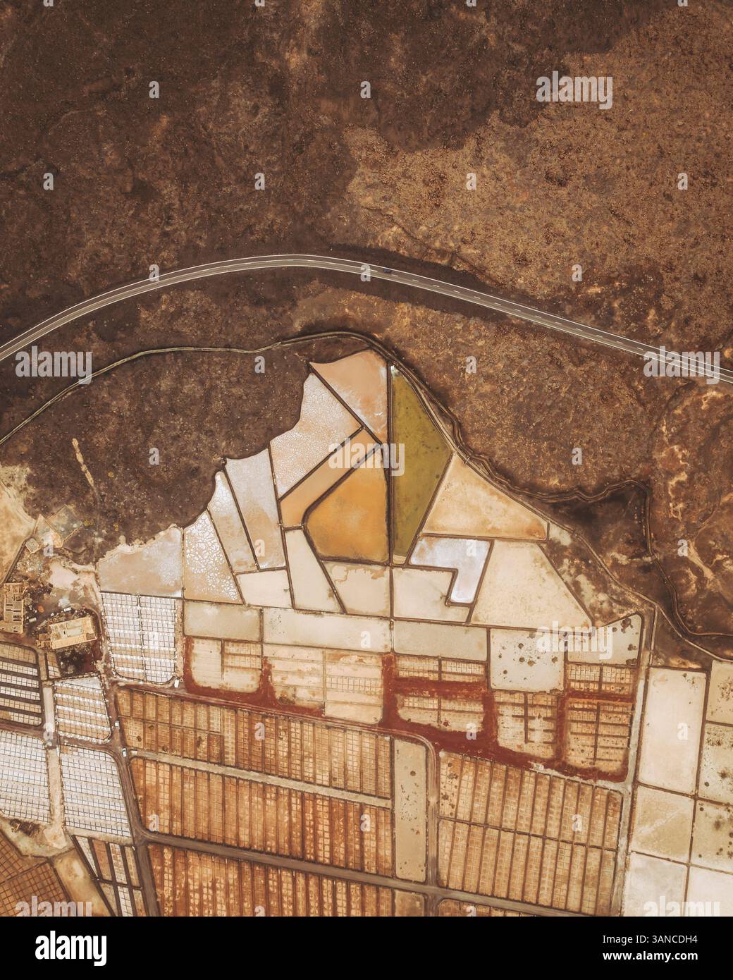 Aerial view of geometric patterns in colorful salt marshes and salt ...