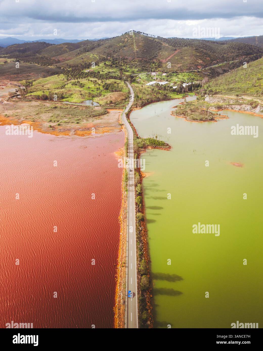 Aerial view of colorful landscape with red and green water, winding ...