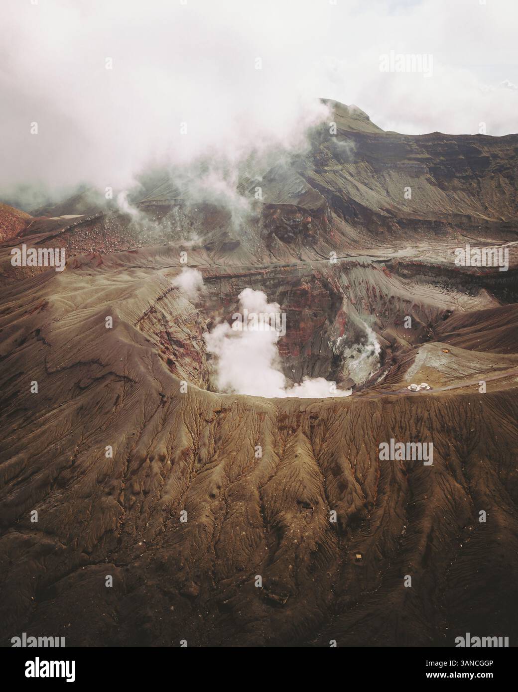 Aerial shot of Mount Aso Crater erupting, Kumamoto Prefecture, Kyushu ...