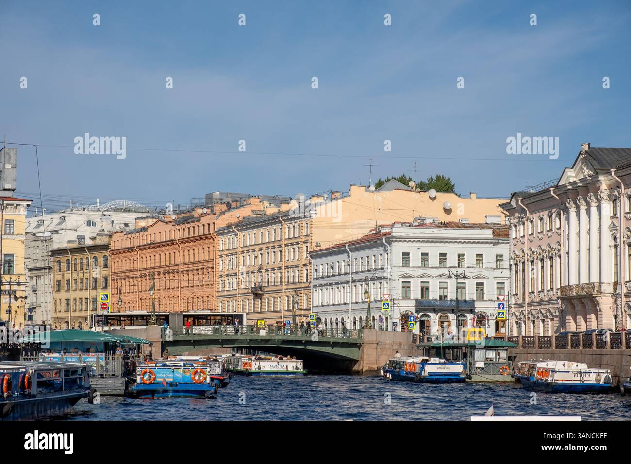 Colorful buildings lining the waterways of Saint Petersburg under a ...