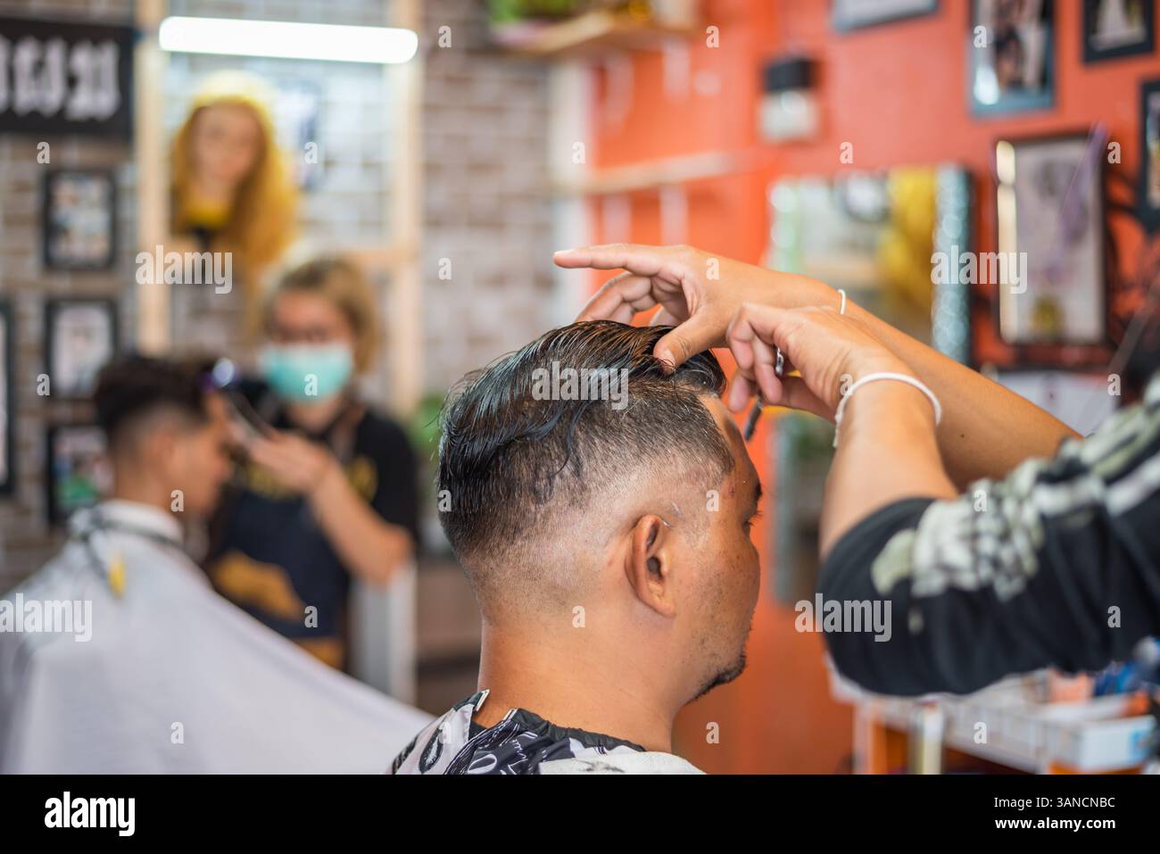 Bangkok, Thailand - April 25, 2017 : Unidentified Thai man barber ...