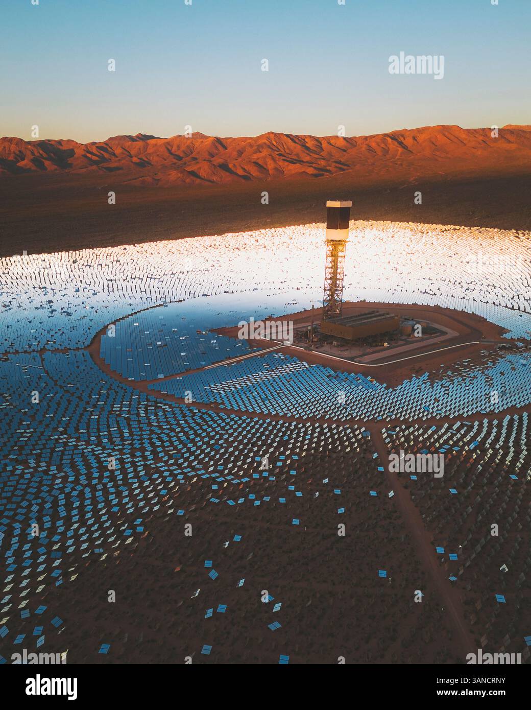 Aerial view of a concentrated solar thermal plant at sunrise, Mojave ...