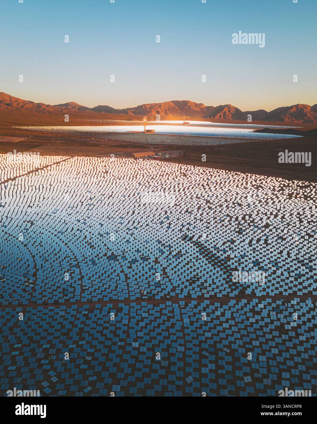 Aerial view of a concentrated solar thermal plant at sunrise, Mojave ...
