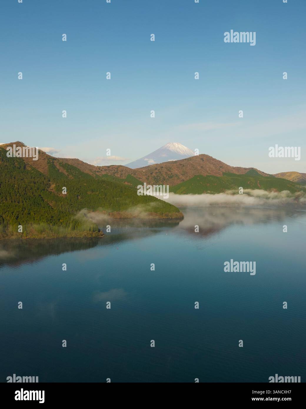 Aerial view of Lake Ashi with Mount Fuji in the background at sunrise ...