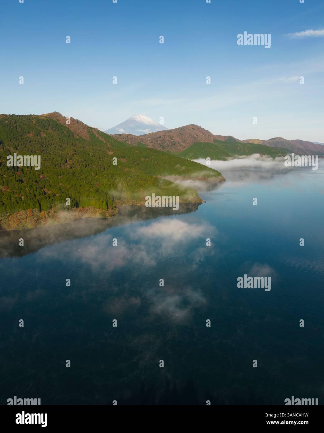 Aerial view of Lake Ashi with Mount Fuji in the background at sunrise ...