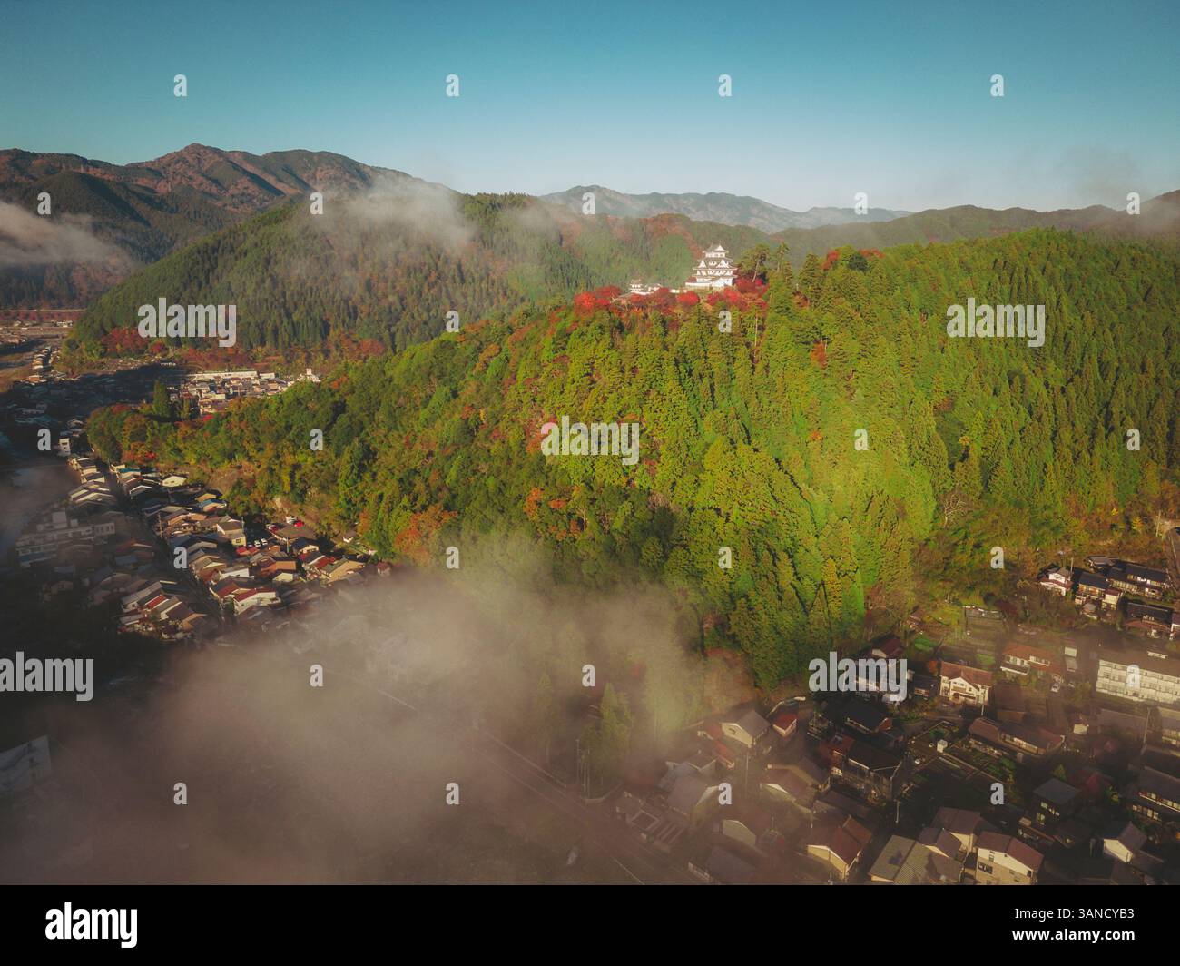 Aerial view of Gujo Hachiman Castle at sunrise during koyo season, Gujo ...