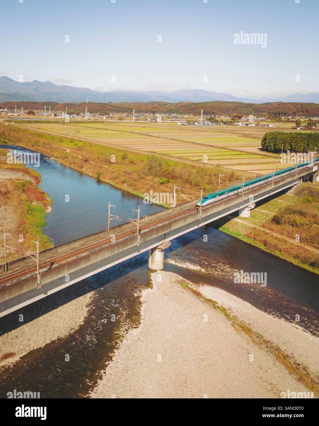 Aerial view of the Tohoku Shinkansen bullet train on a bridge, Tochigi ...