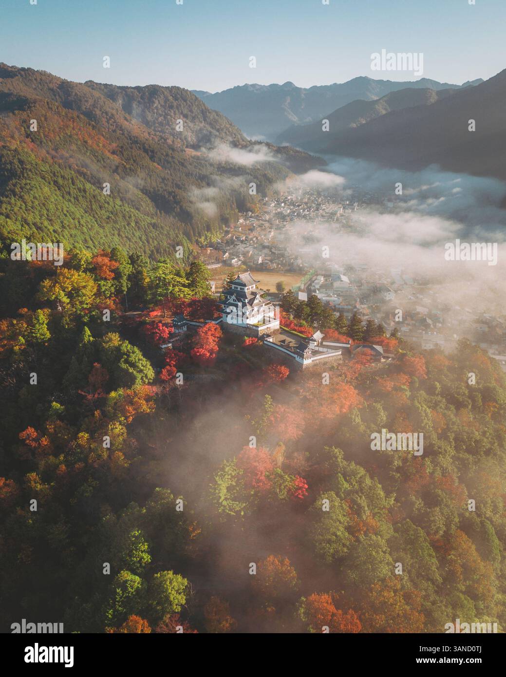 Aerial view of Gujo Hachiman Castle at sunrise during koyo season, Gujo ...