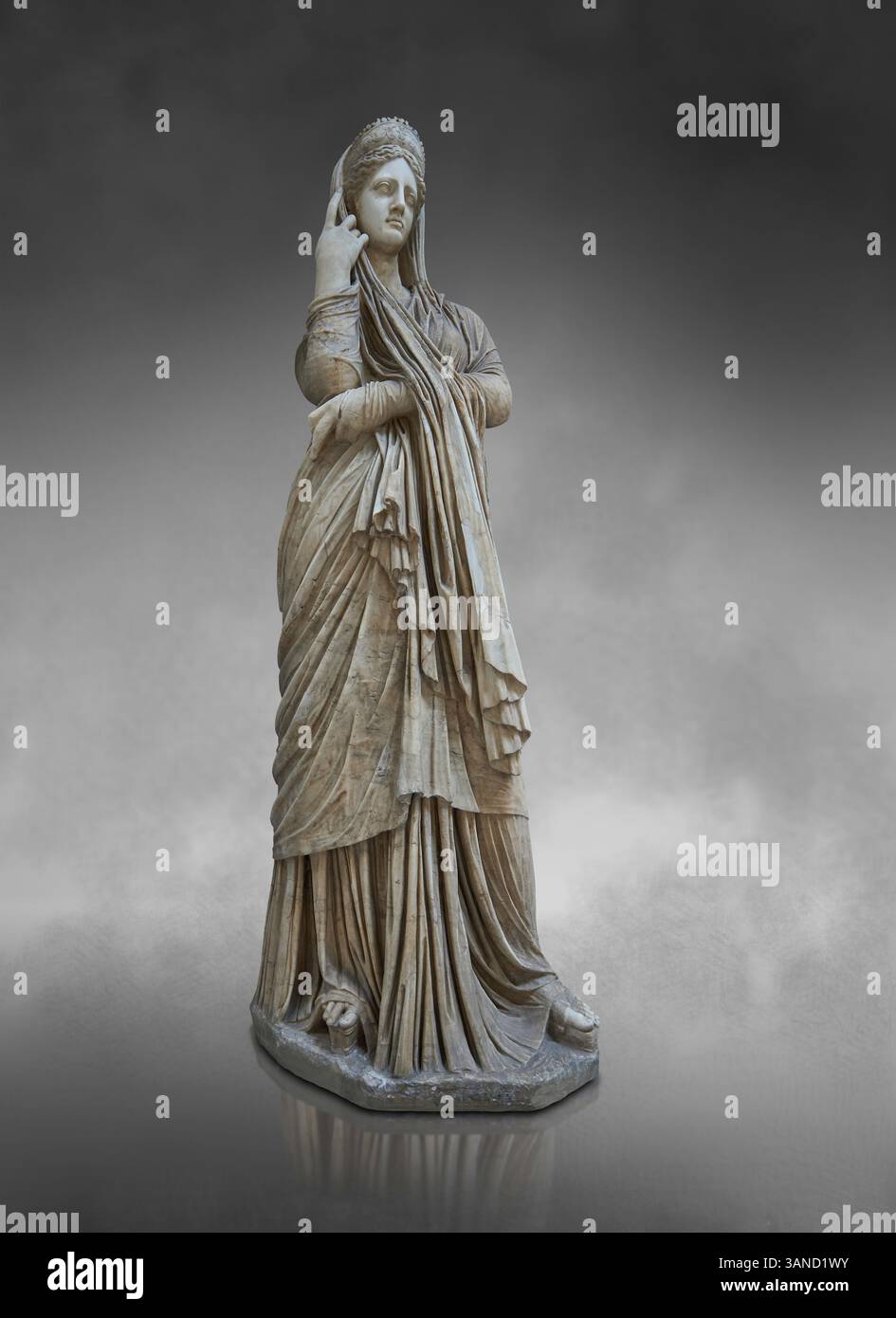 Roman statue of a standing Roman woman wearing a long flowing tunic ...