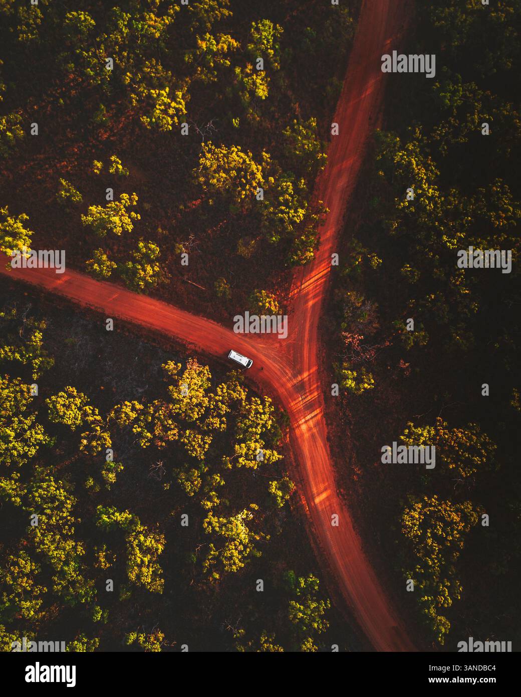 Aerial view of a vehicle driving a road near Kalkani crater, Undara ...