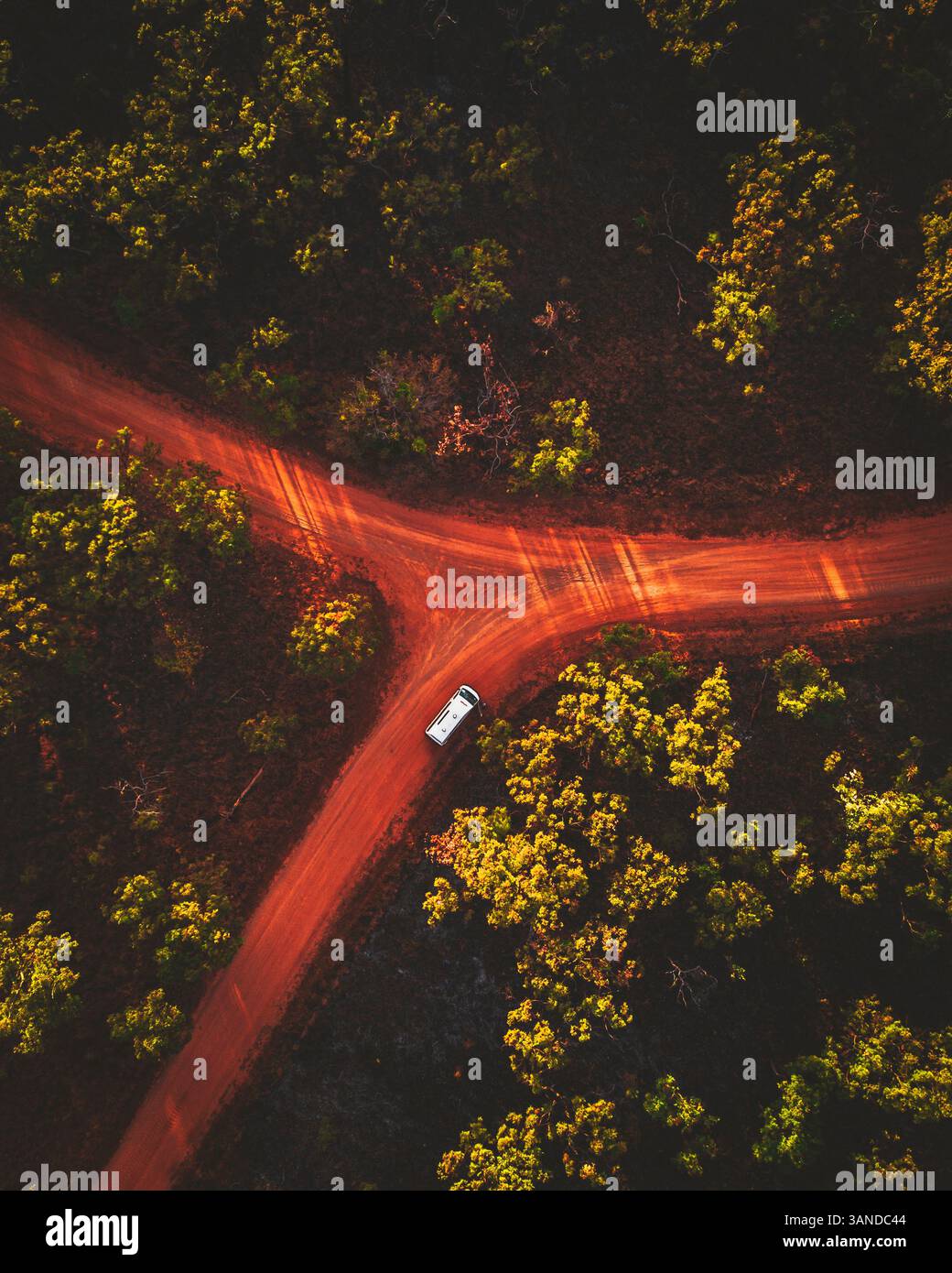 Aerial view of a vehicle driving a road near Kalkani crater, Undara ...