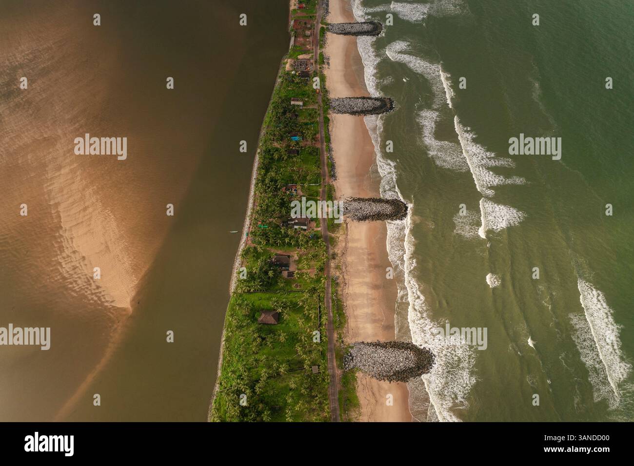 Aerial view of breakwater along a strip of land with Pithrody beach and ...