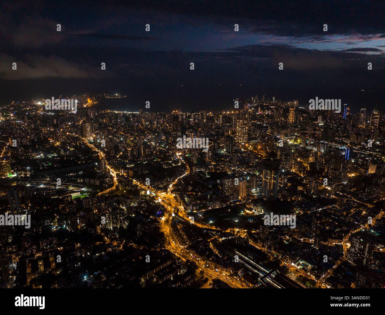 Aerial View of Mumbai City in the night on the coast, Mahalakshmi ...