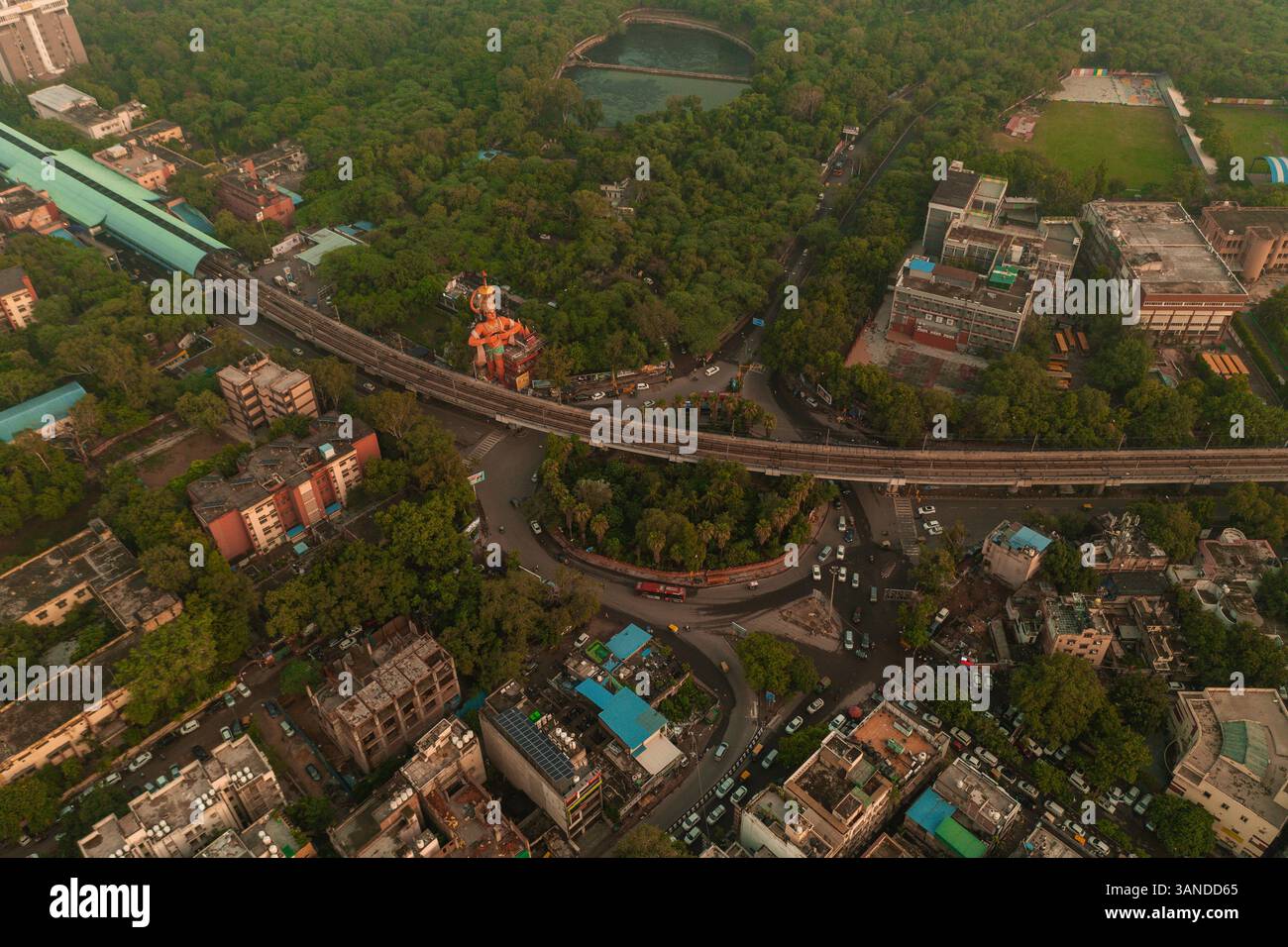 Aerial view of a railroad crossing the city with Hanuman Temple, in New ...