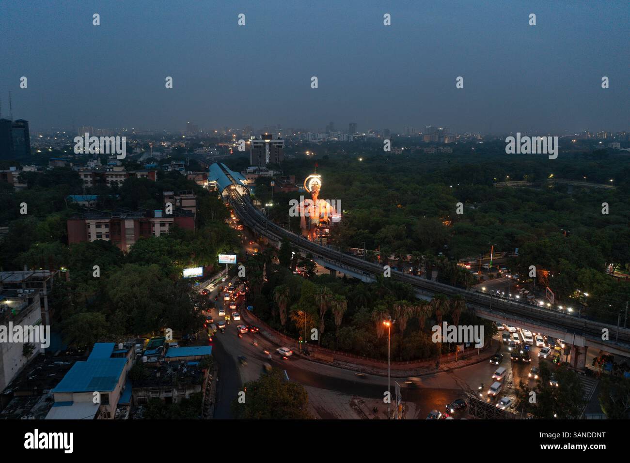 Aerial view of a railroad crossing the city with Hanuman Temple, in New ...