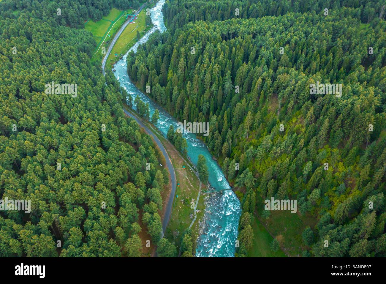 Aerial view of a river crossing a forest near Pahalgam, Jammu and ...