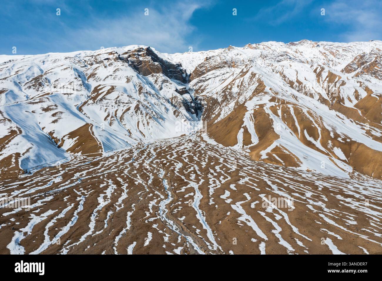 Aerial view of snow melting in springtime on mountain crest along Spiti ...