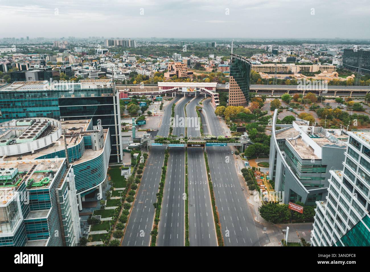 Aerial view of Gurugram district with buildings and an empty suspended ...