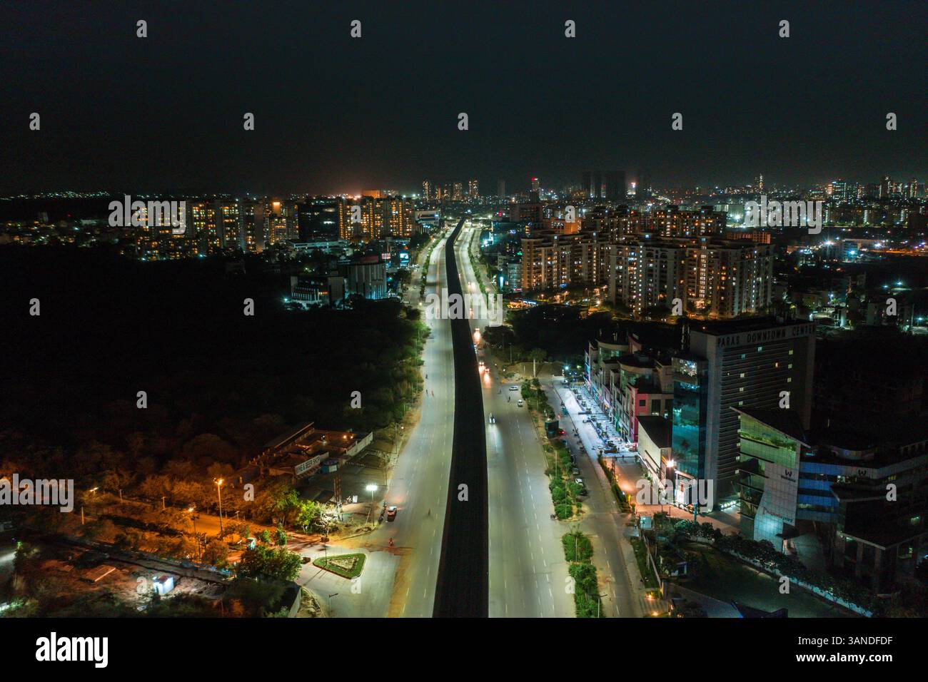 Aerial view of tall skyscraper in Gurugram near the motorway and the ...