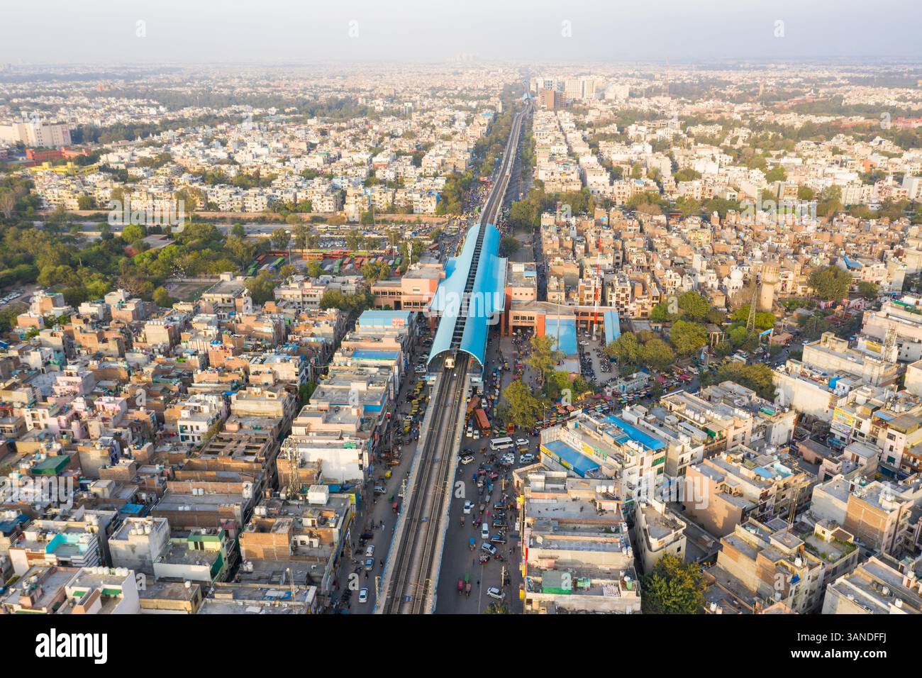 Aerial view of New Delhi public transport system crossing neighborhood ...