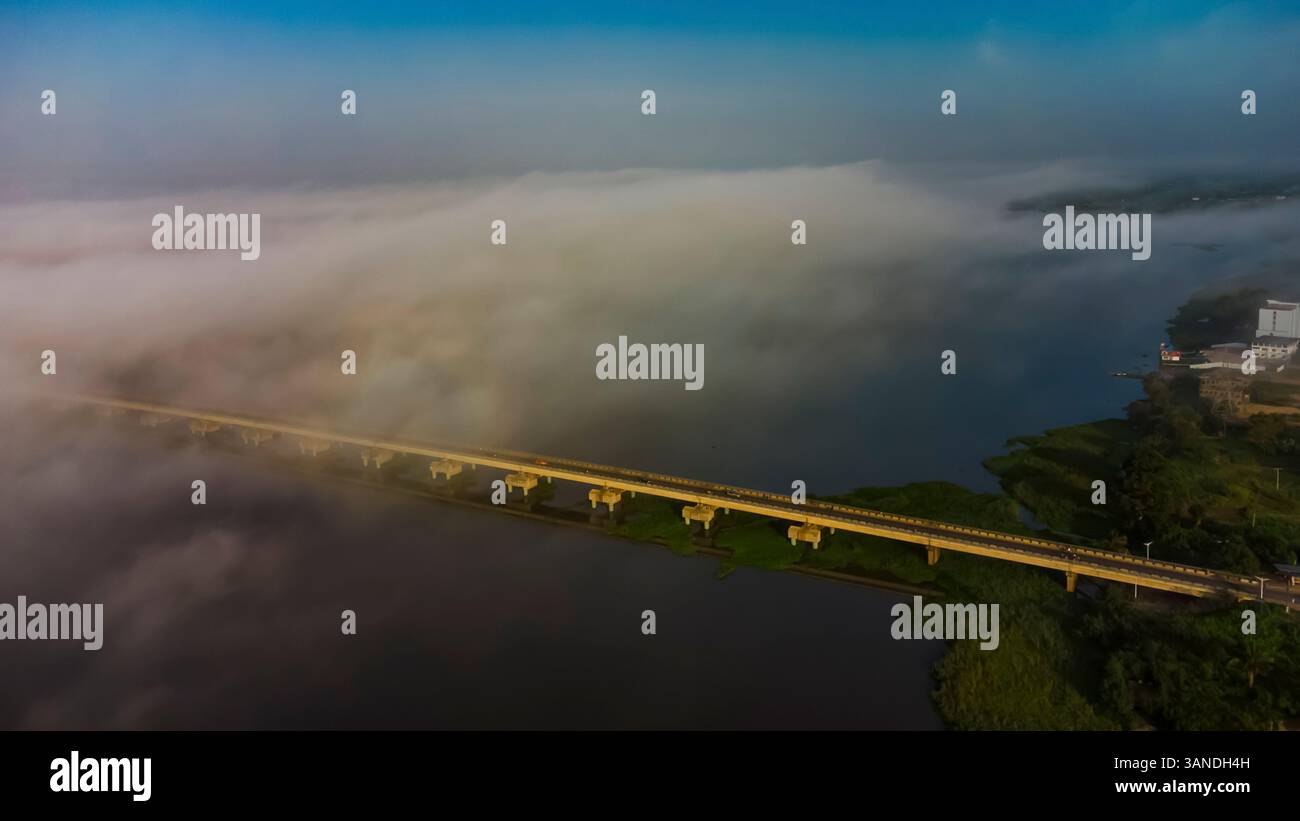 Aerial view of the beautiful Lower Volta Bridge over a foggy river ...