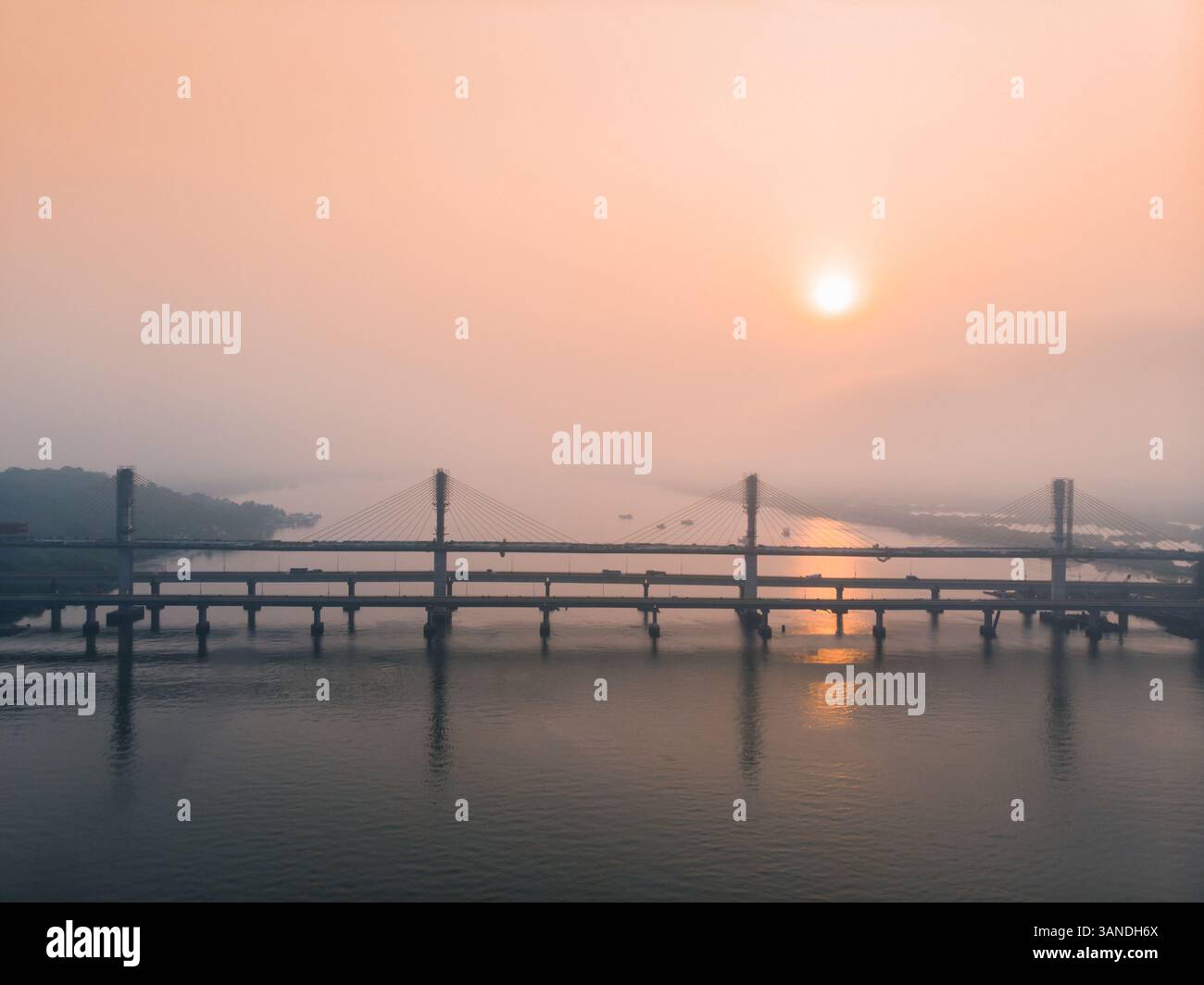 Aerial view of Panjim bridge over Mandovi river during the sunrise in ...