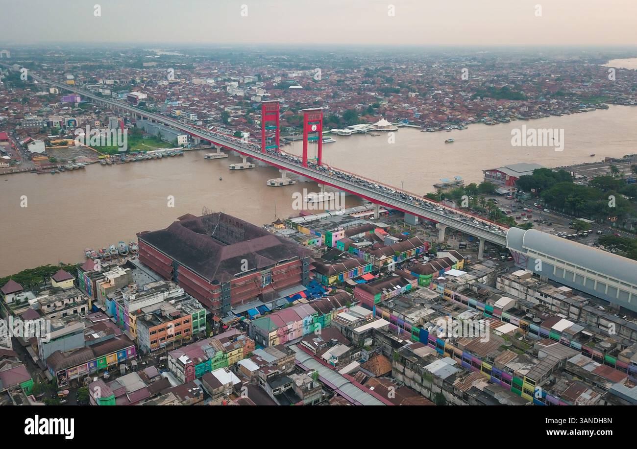Aerial view of Ampera bridge over Musi river in Palembang city in south ...