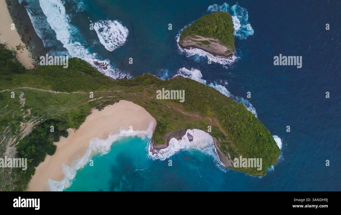 Top aerial view of the t-rex cliff at Kelingking beach ona fine bright ...