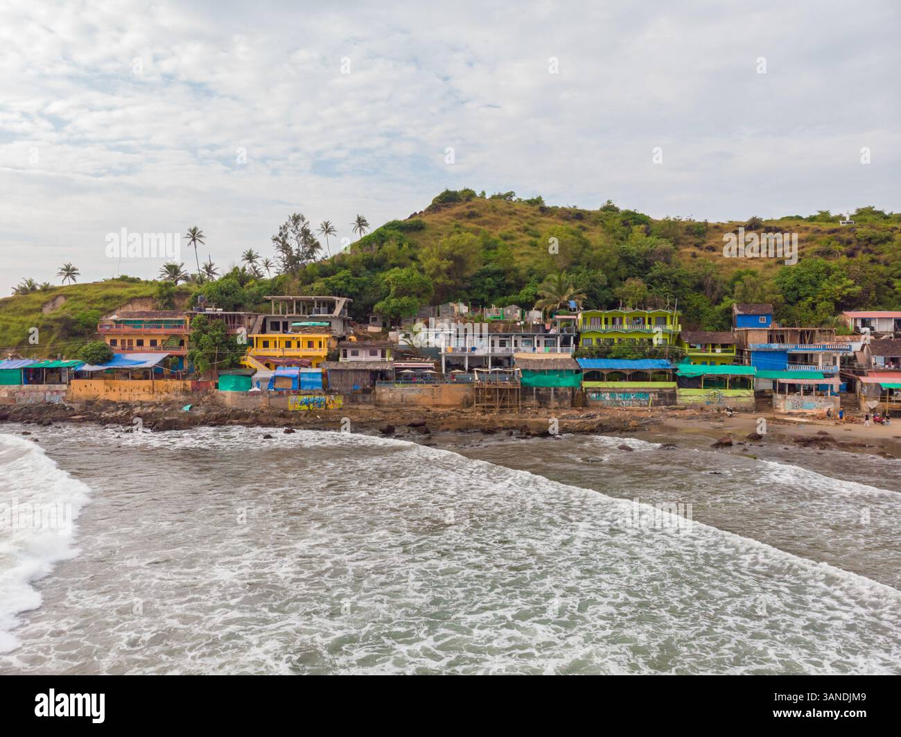 Aerial view of colorful huts by the Arambol beach in north goa, India ...