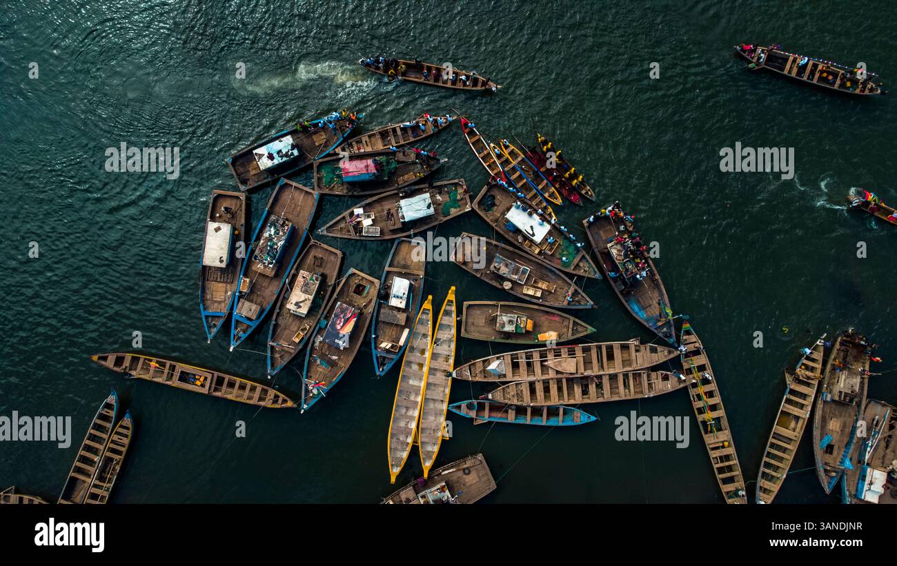 Aerial view of traditional wooden boats on clear water of a river ...