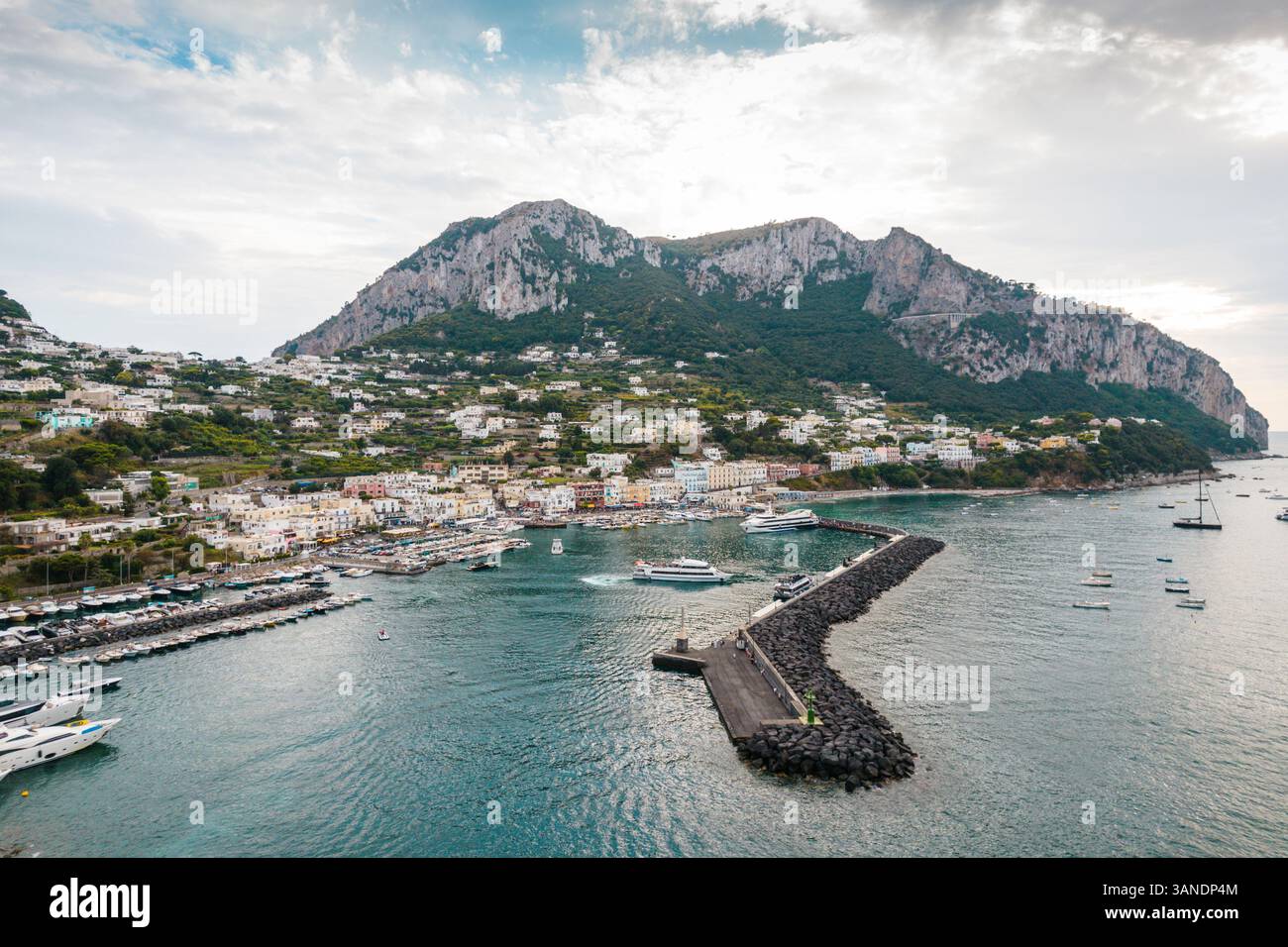 Aerial view of scenic Capri village with beautiful harbor and rocky ...
