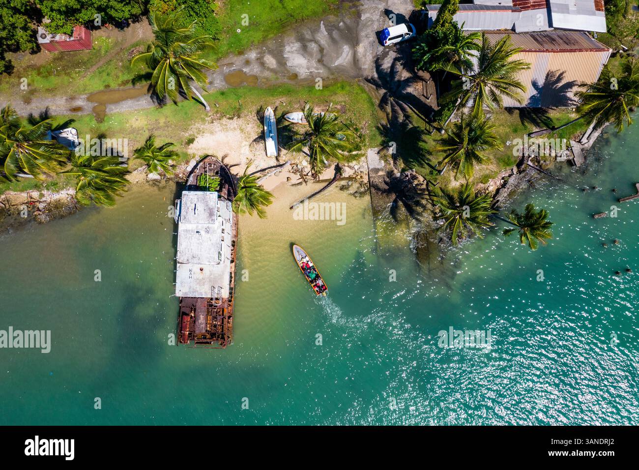 Aerial View of Coast with Shipwreck and Boat in the Water, Wewak, East ...