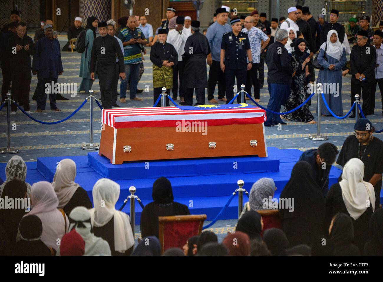 People pay their last respects near the coffin of Malaysia's fifth ...