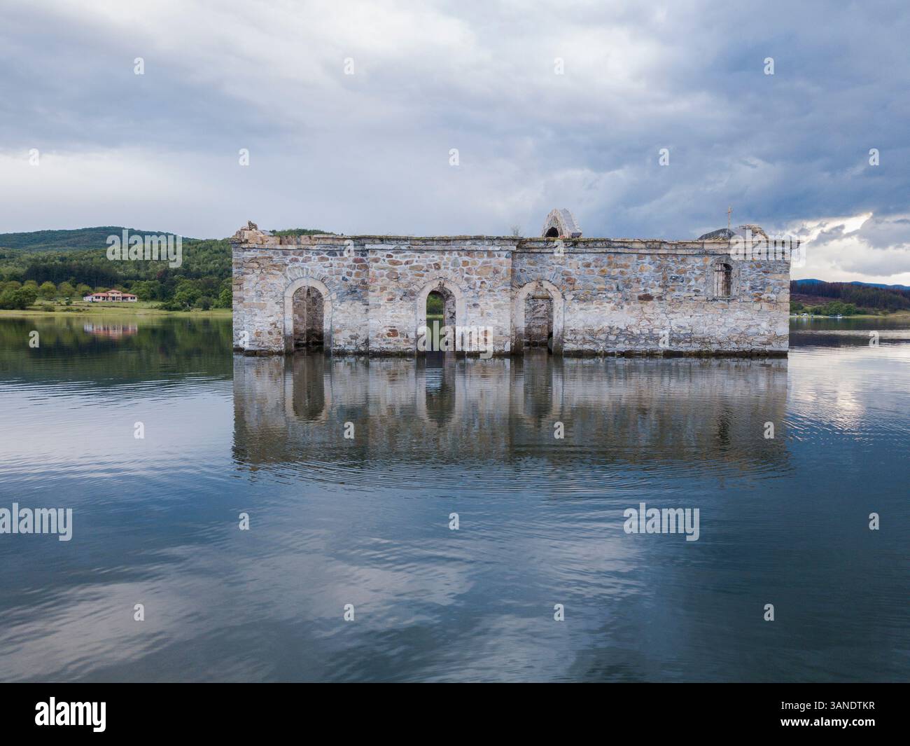 Aerial View of Sunken Church and water reflection in Jrebchevo Dam ...
