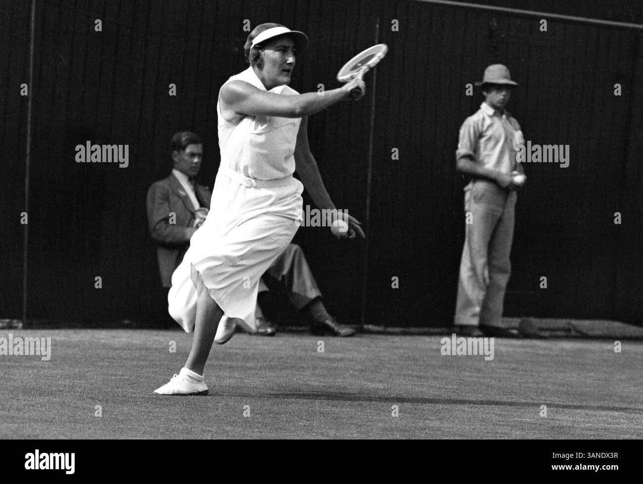 Simonne Mathieu in play against Helen Jacobs, unseen, in the quarter ...