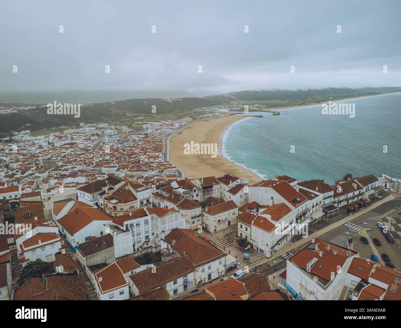 Aerial view of Sitio Old Town with beautiful rooftops and sandy beach ...