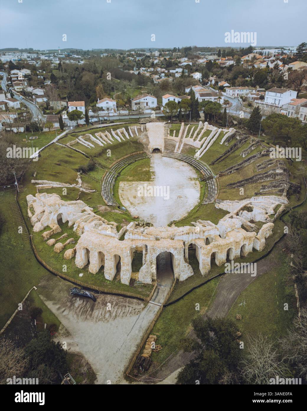 Aerial view of the ancient amphitheater surrounded by greenery and ...